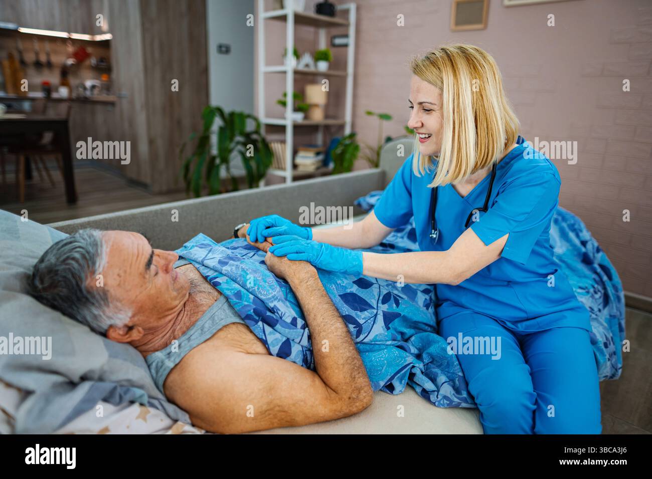 Caring nurse provides comfort hi-res stock photography and images - Alamy