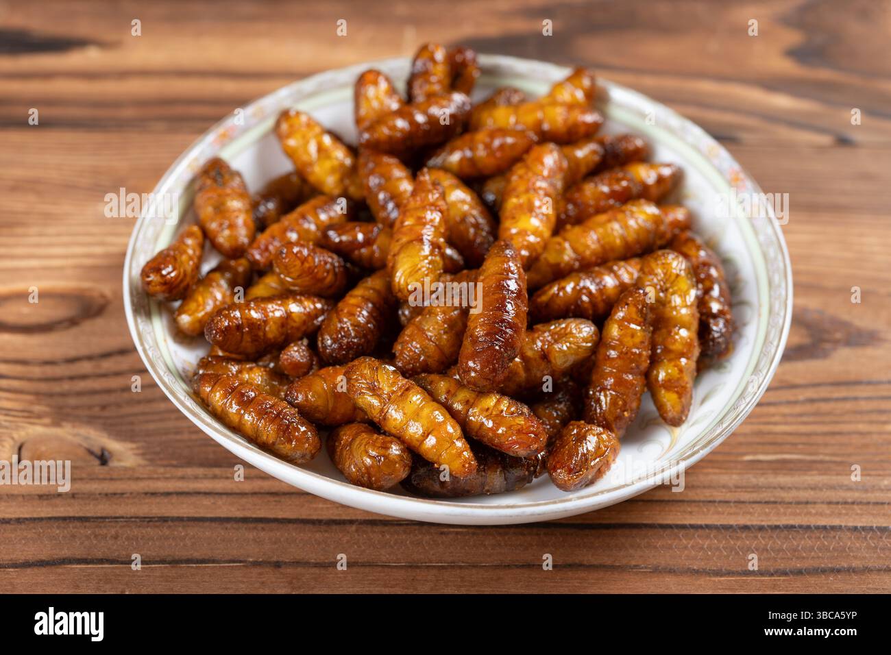 angle view edible silkworm pupae at horizontal composition Stock Photo ...