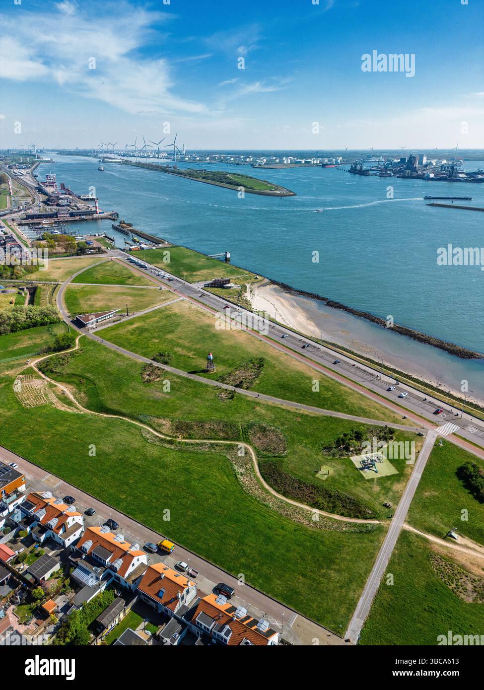 Aerial view of a coastal town with green parks, residential areas, a ...