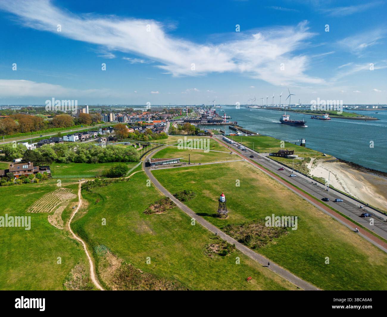 Aerial view of a coastal town with green parks, residential areas, a ...
