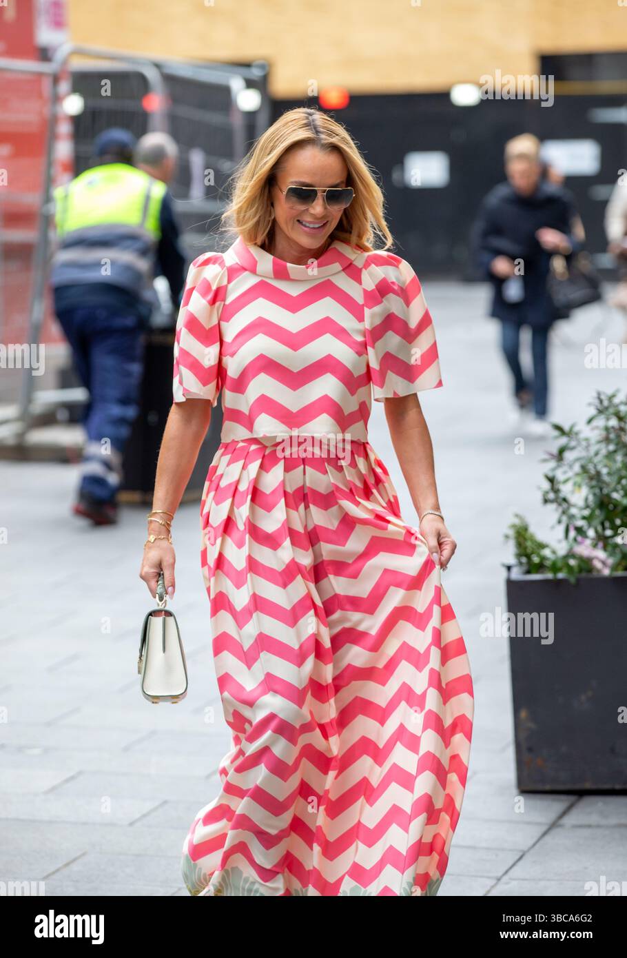 London, UK. 19th May, 2025. Amanda Holden looks stunning in a Palm ...