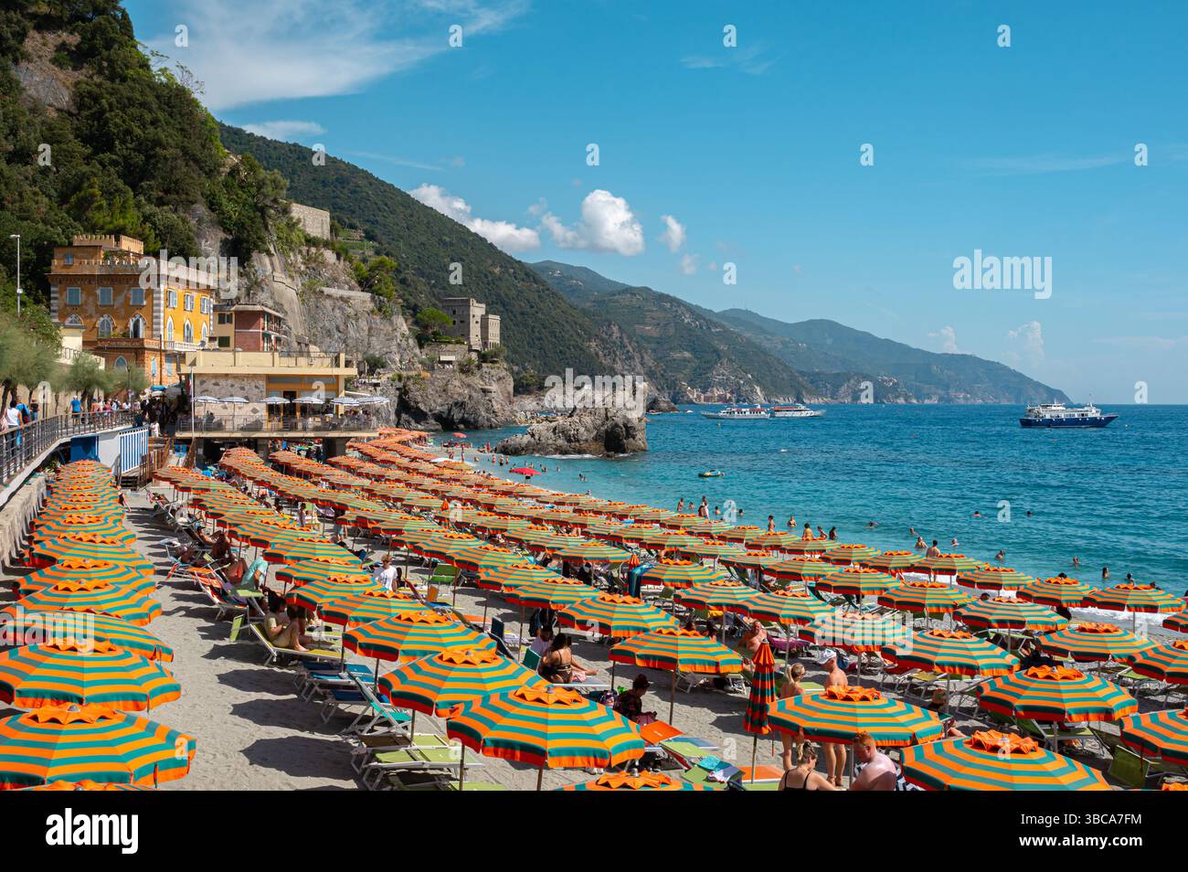 Cinque Terre, Italy - Sep 7, 2022: Crowded beach in Monterosso Al Mare, Italy, showing rows of ...
