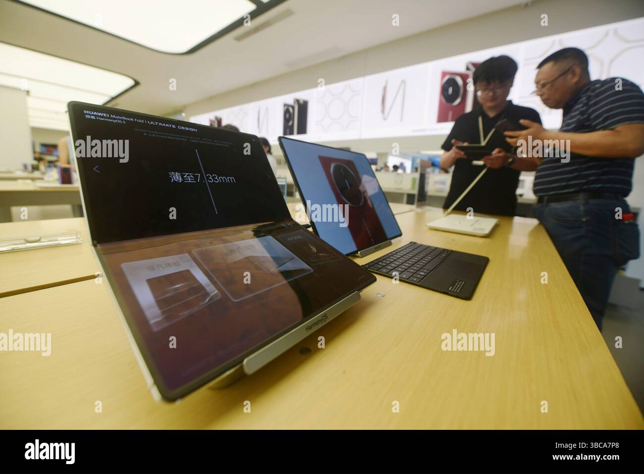 A view of two Huawei Matebook Fold computers, which can be unfolded ...