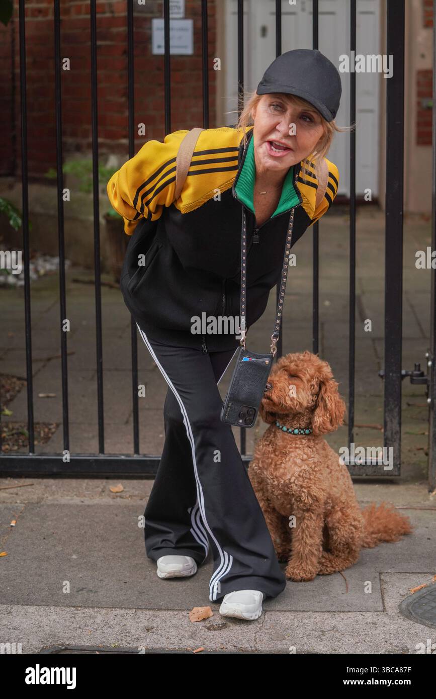 London, UK. 19 May 2025. Singer and songwriter Lulu poses with her dog ...