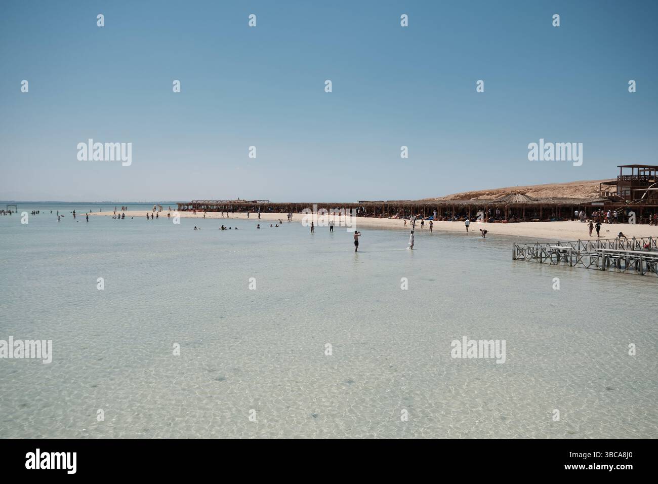 Sunny shoreline people swimming in hi-res stock photography and images ...