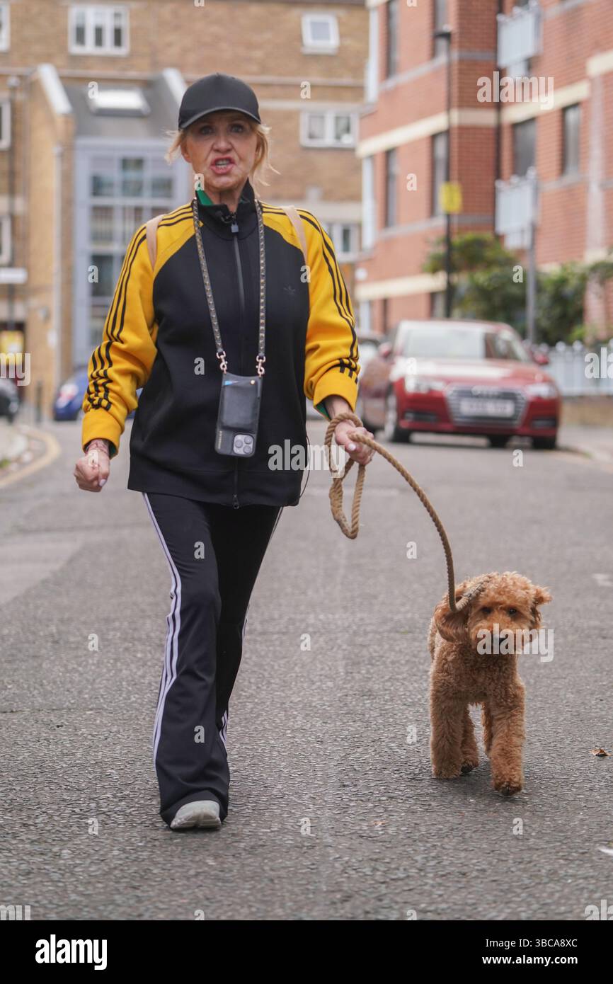 London, UK. 19 May 2025. Singer and songwriter Lulu poses with her dog ...