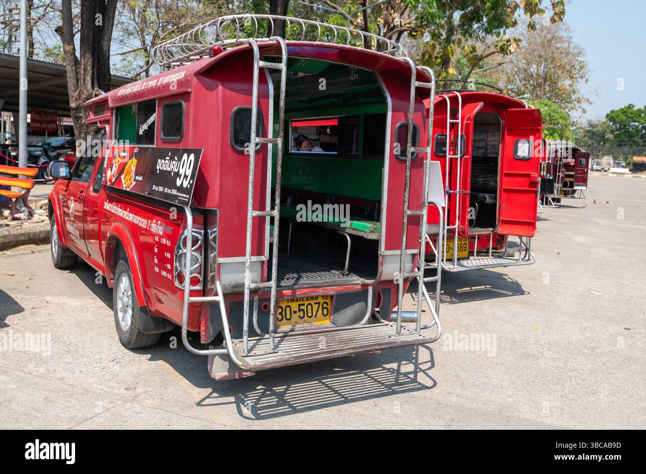 A fleet of songthaews for fare-paying passengers, is a converted pick ...