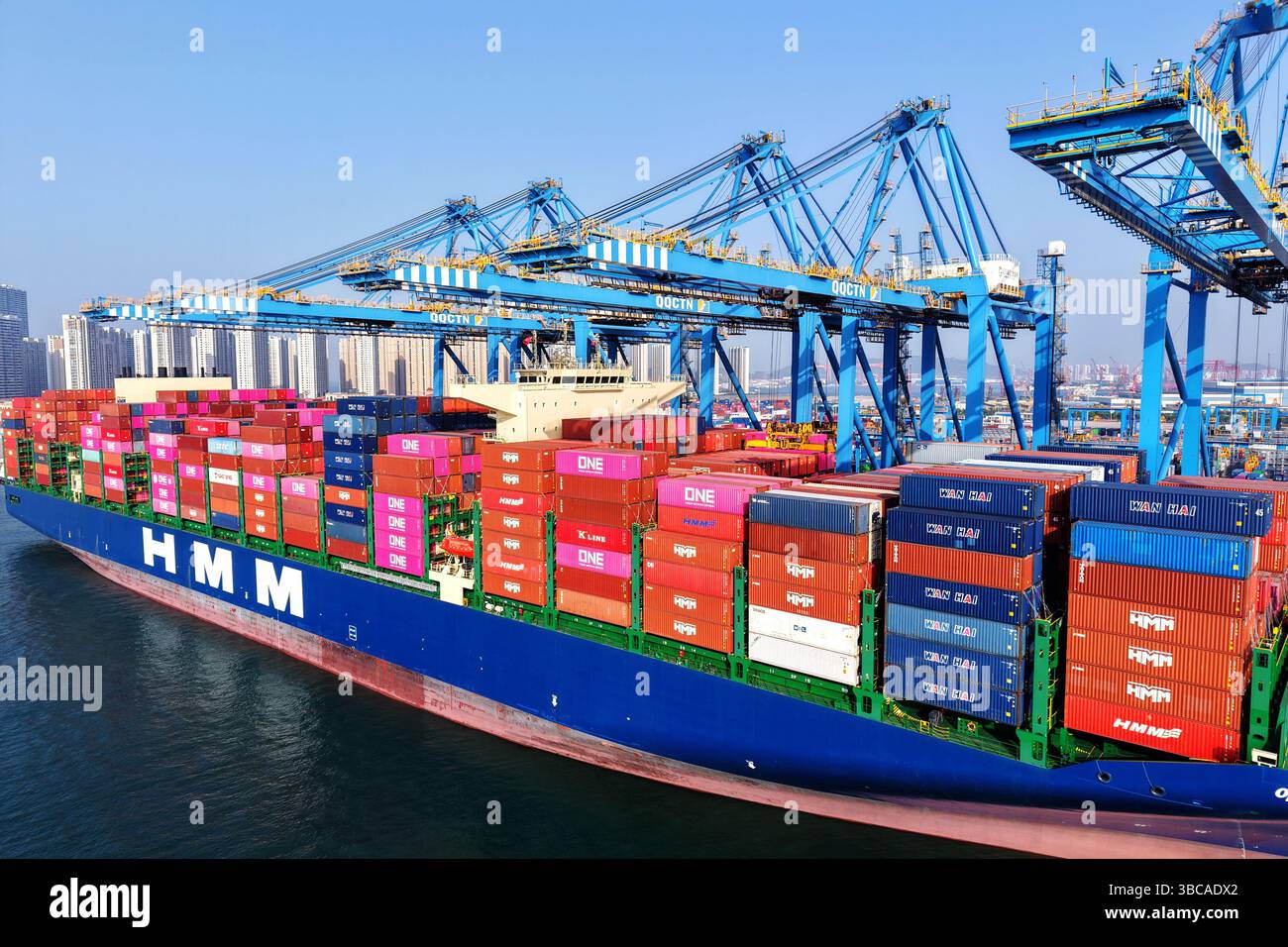 QINGDAO, CHINA - MAY 19, 2025 - A cargo ship is loading containers at ...