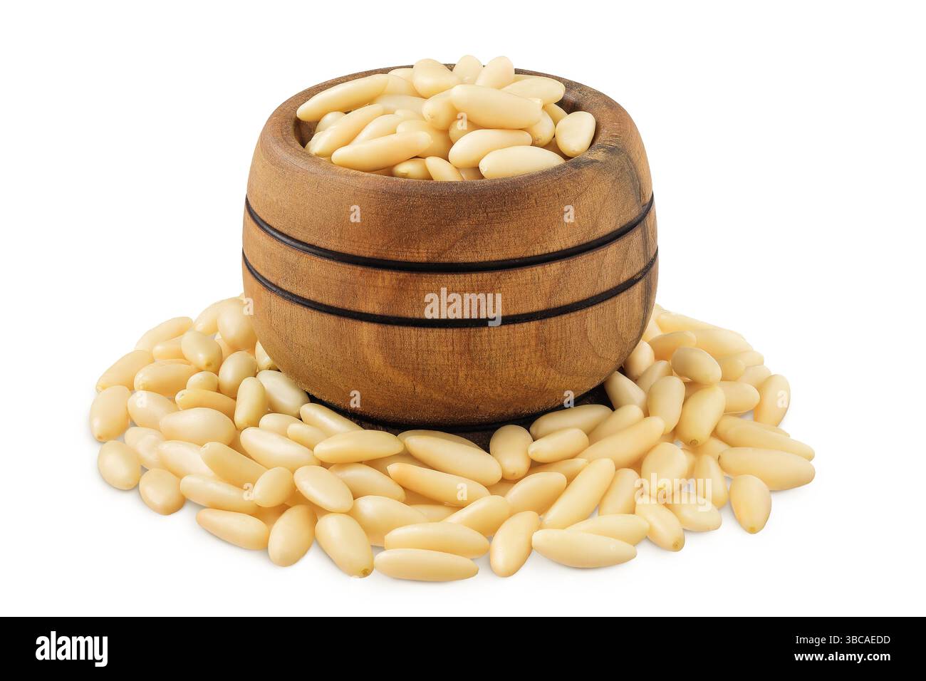 Shelled European pine nuts in wooden bowl isolated on white background ...