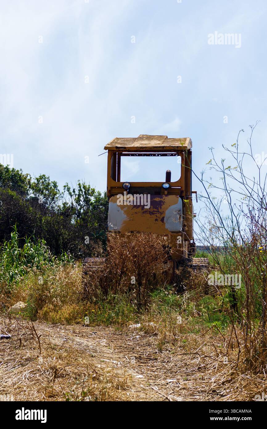 Rustic Bulldozer in Rural Field with Overgrown Vegetation and Clear ...