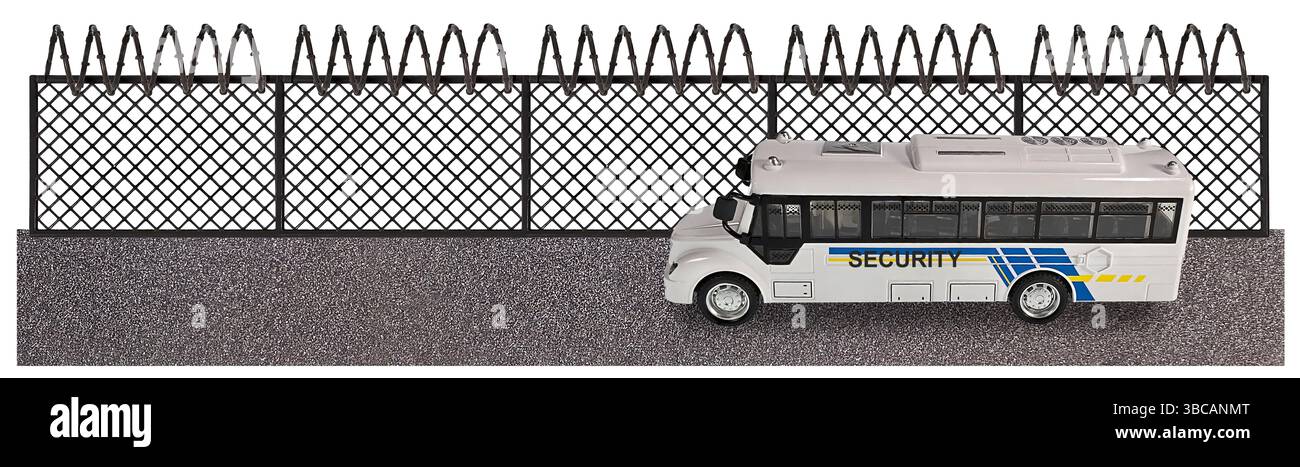 Security Bus n front of a Barbed Wire Fence surrounding an area being ...