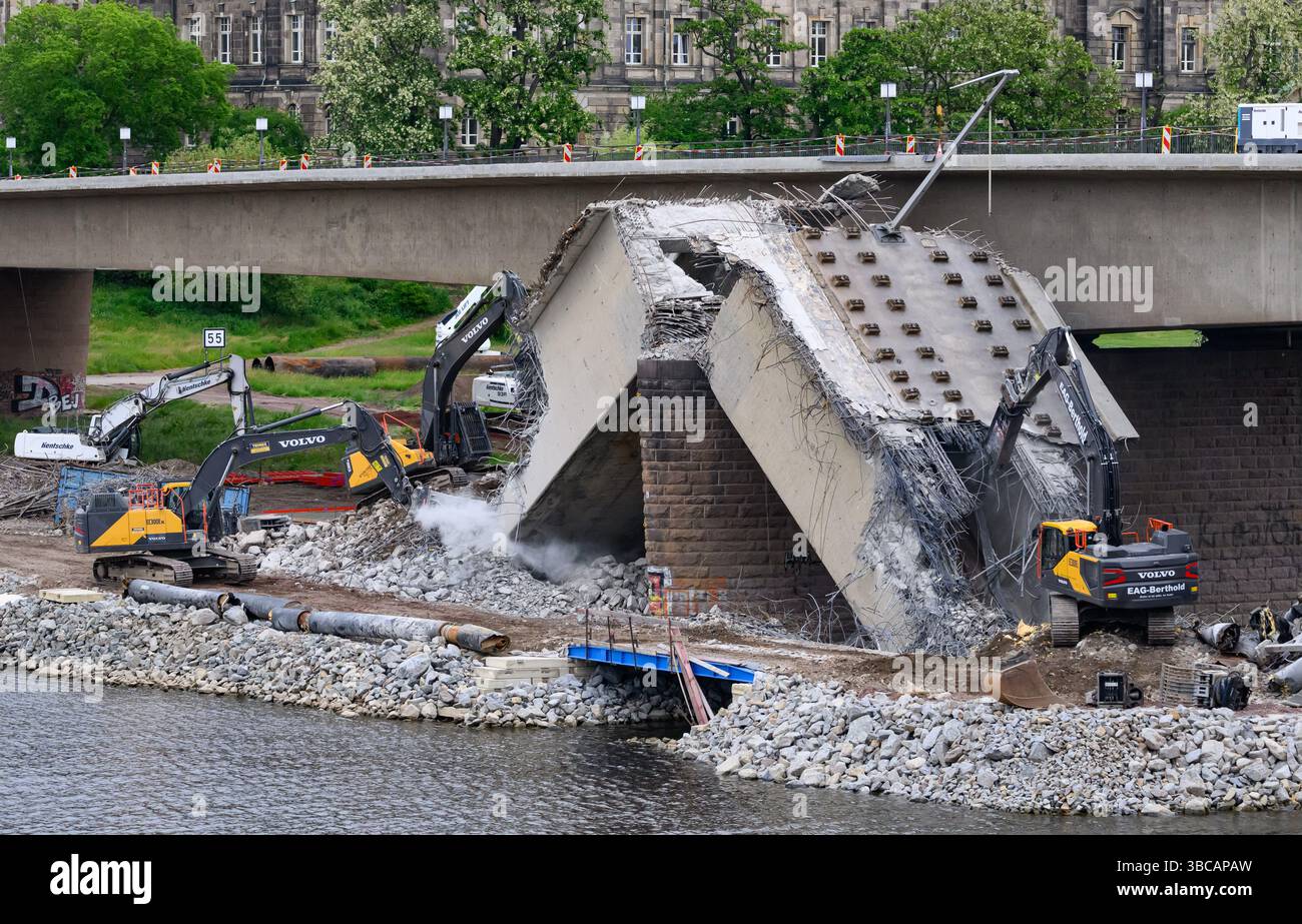 Dresden, Germany. 19th May, 2025. Excavators are used to demolish the ...