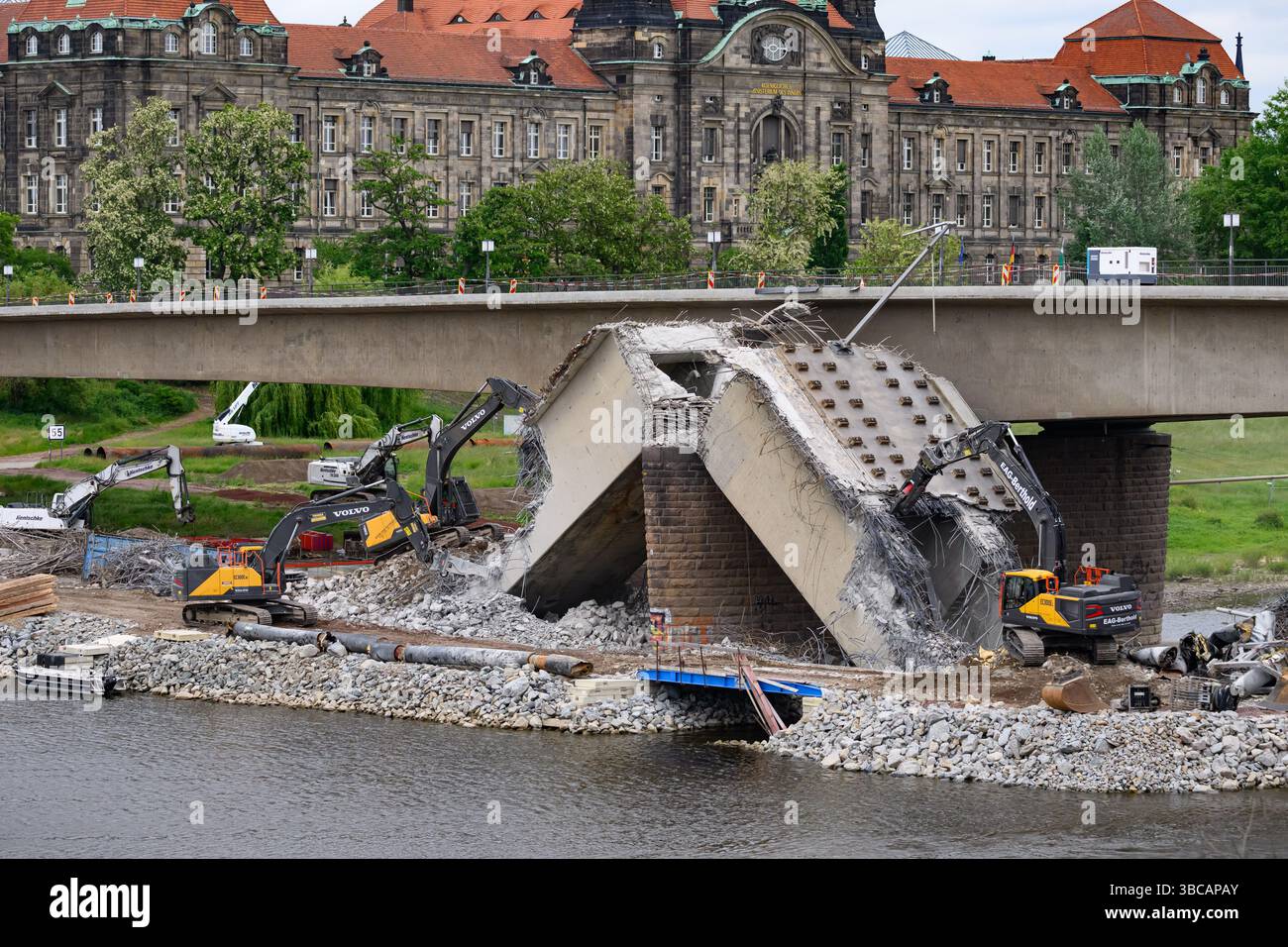 Dresden, Germany. 19th May, 2025. Excavators are used to demolish the ...