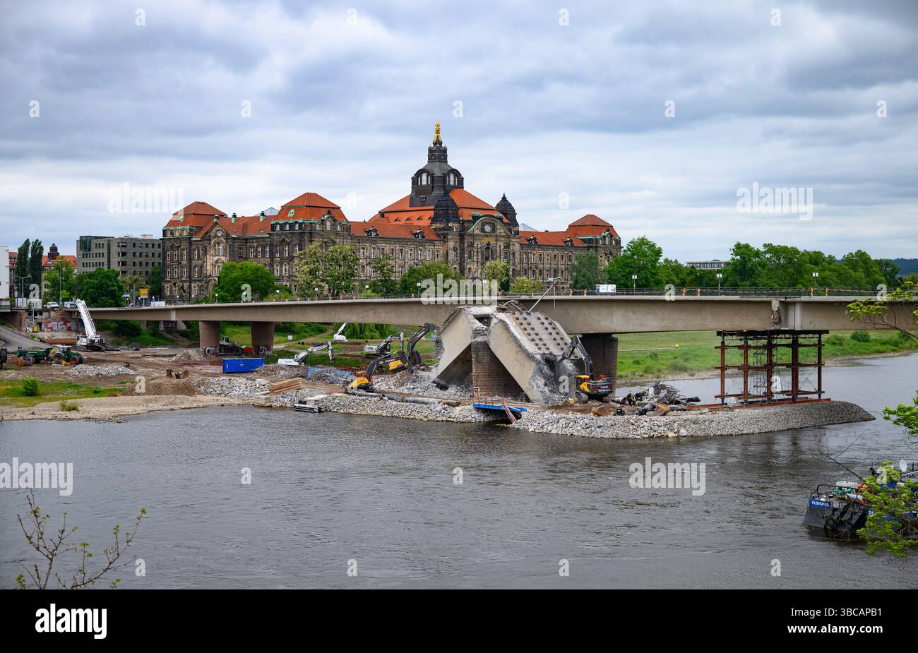 Dresden, Germany. 19th May, 2025. Excavators are used to demolish the ...