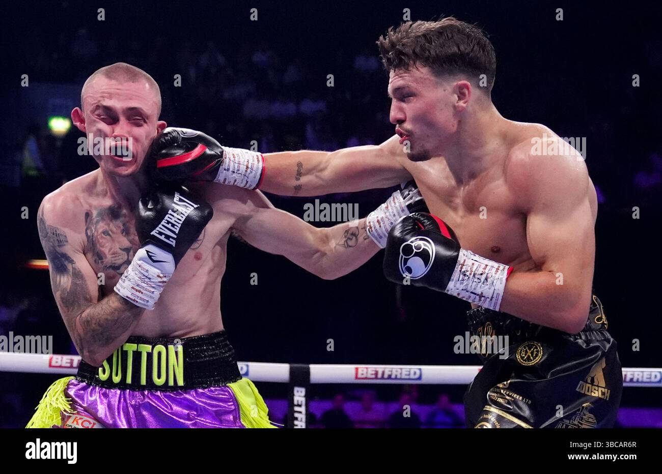 George Liddard and Aaron Sutton (left) during their Middleweight bout ...