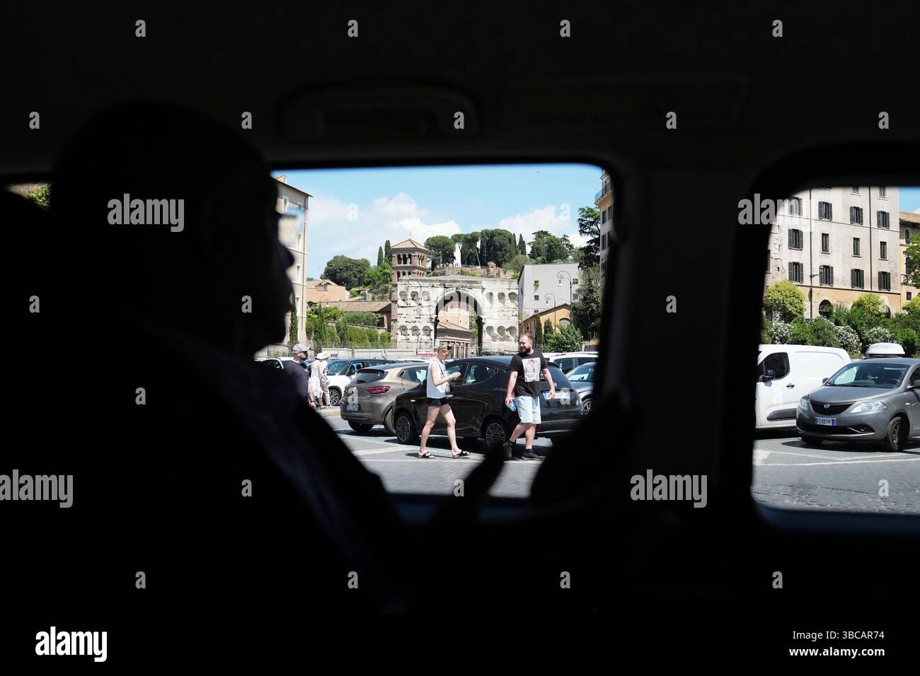 People take photos as they look at Vice President JD Vance's motorcade ...
