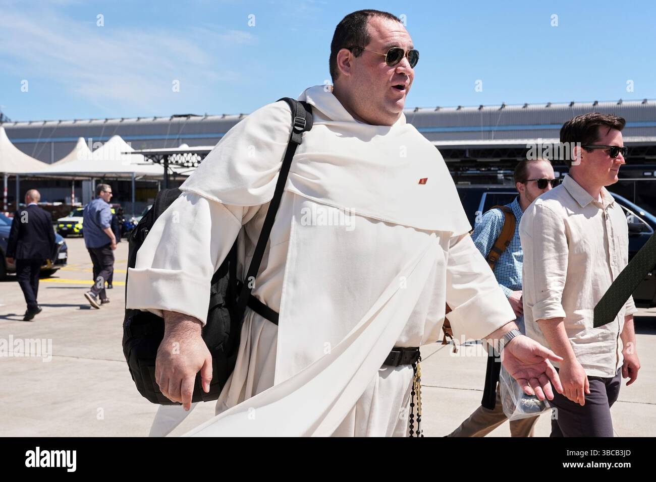 Father Henry Stephan arrives to board Air Force Two at Leonardo da ...