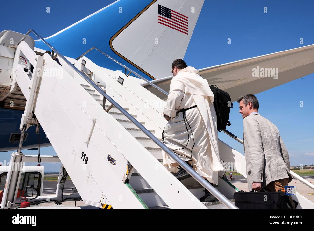 Father Henry Stephan, left, boards Air Force Two at Leonardo da Vinci ...