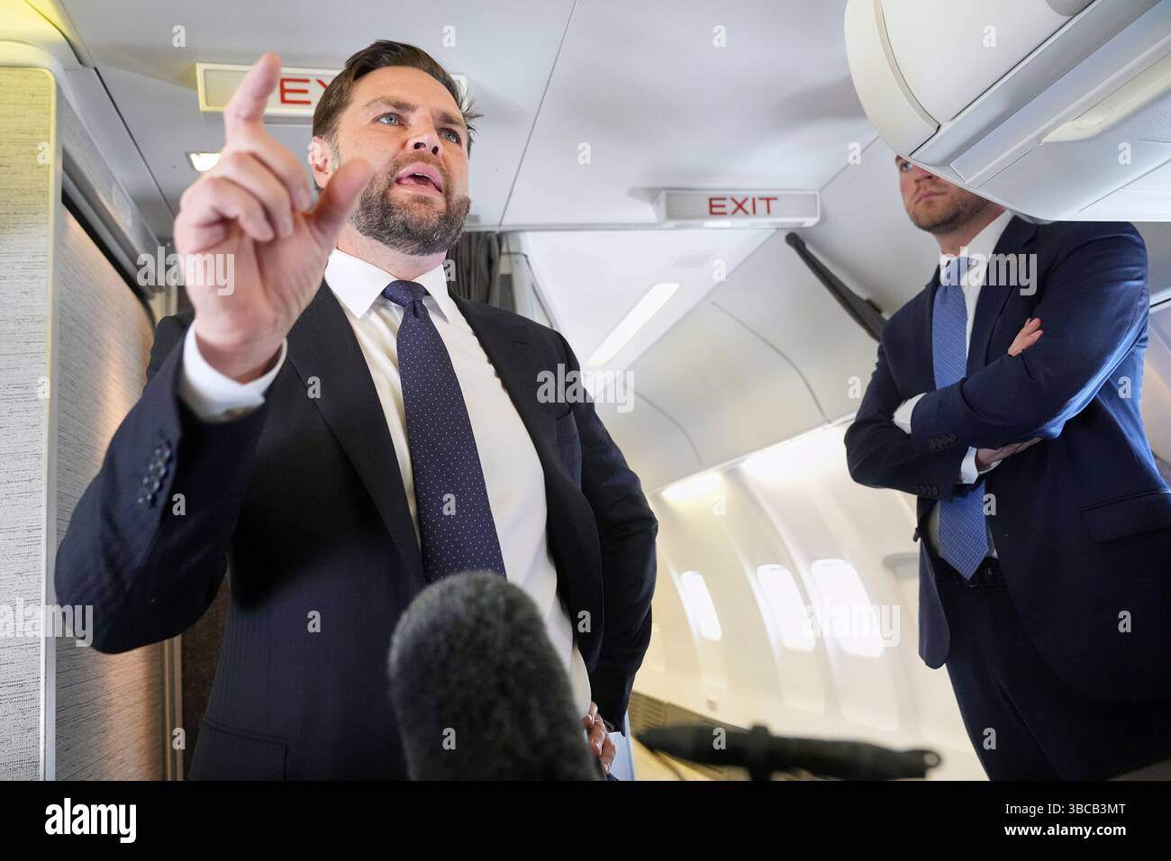 Vice President JD Vance talks to reporters on board Air Force Two at ...