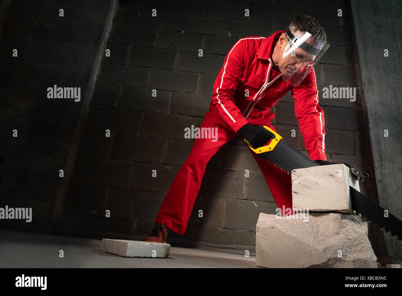 Worker cuts building blocks hi-res stock photography and images - Alamy