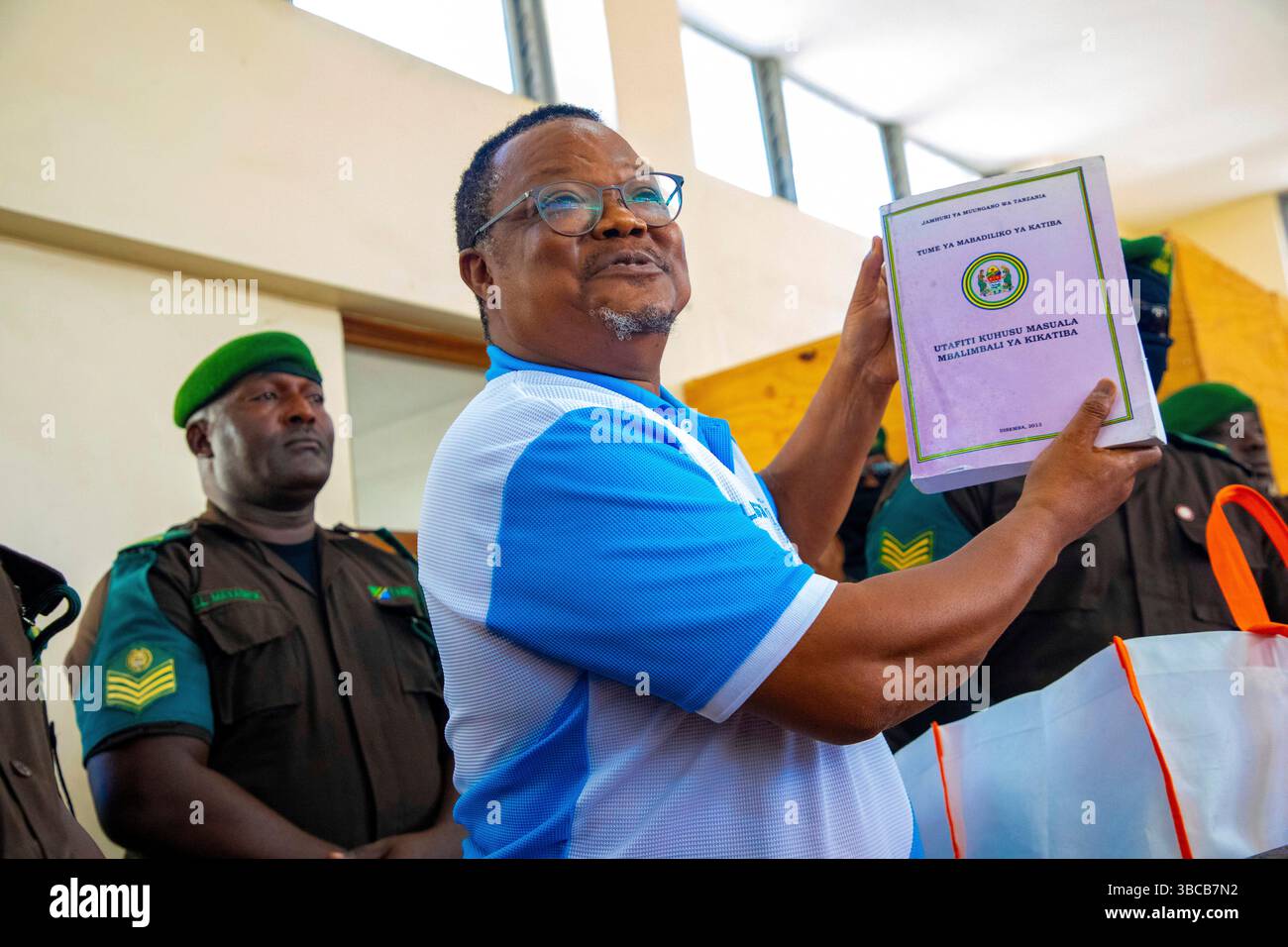Tanzania's main opposition leader Tundu Lissu, holds up a proposed ...