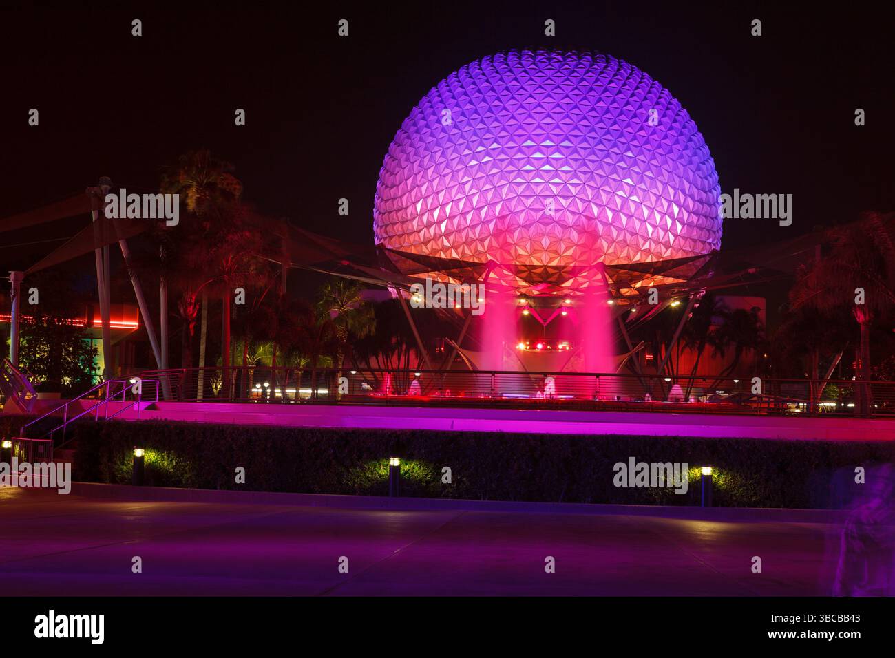 The World Showcase lake, and Spaceshipe earth dome at night, Epcot amusement park, Disney World ...