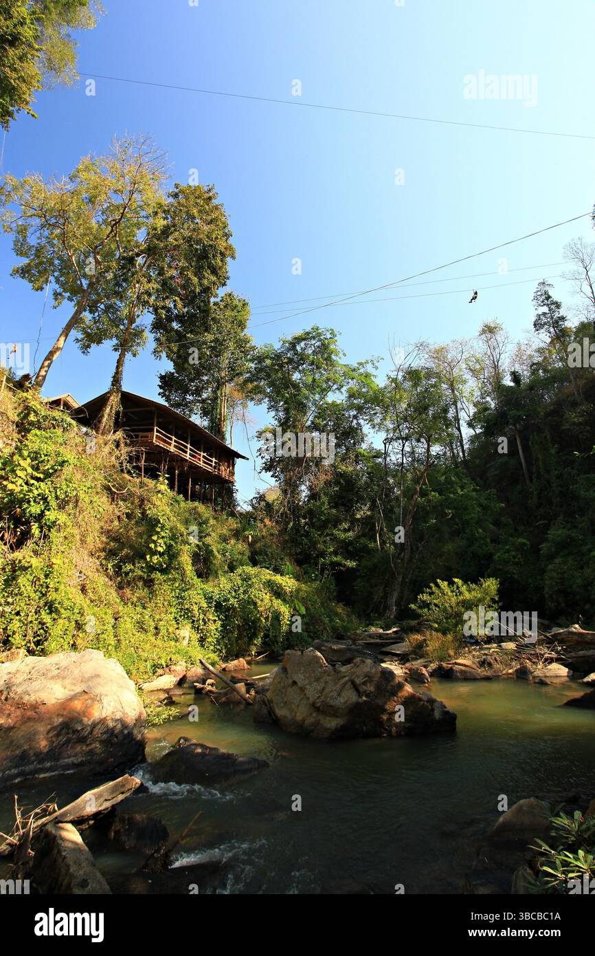 Asian tourists adventure on a zip line in Ban Mae Wang, Chiang Mai ...