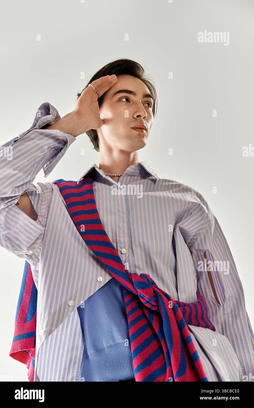 Fashion-forward non binary individual expresses identity through a bold ...