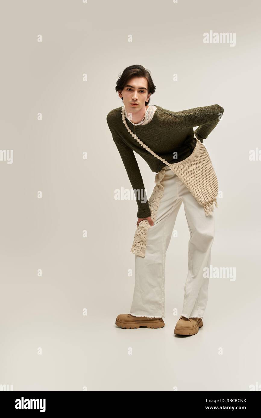 Young non binary individual sports a stylish outfit with unique ...