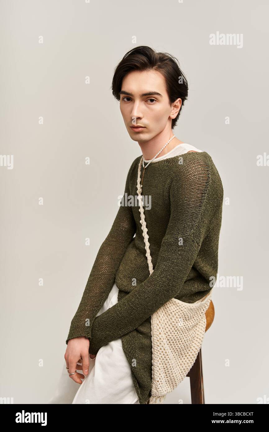 A stylish non binary individual poses confidently in a chic outfit ...