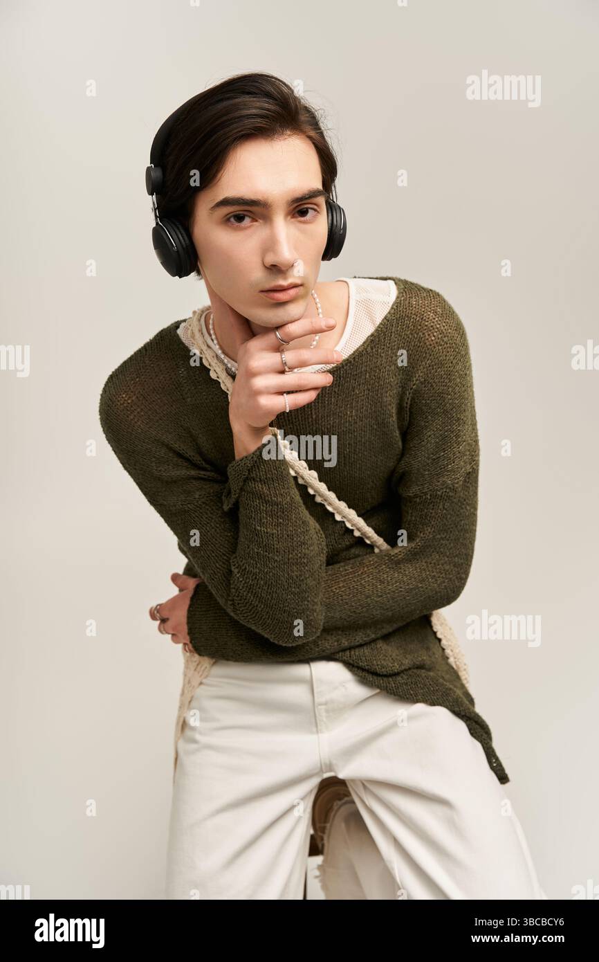 A stylish non-binary person poses confidently, embodying modern pride ...