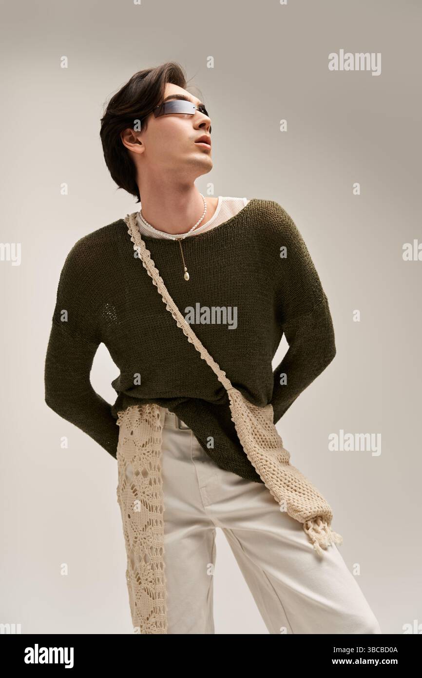 A stylish young non binary person showcases unique fashion in a ...