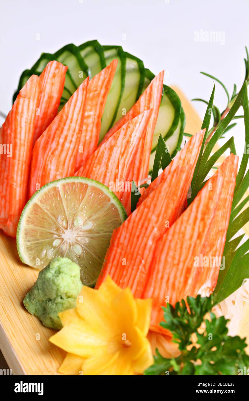 Kani-Kamaboko, Crab stick fish cake, served with shredded oba leaves, Japanese cucumber, wasabi ...