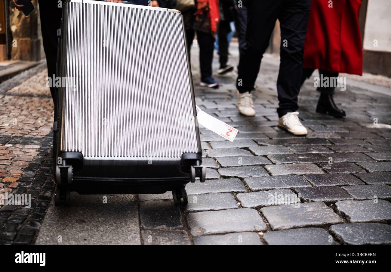 Big Travel Suitcase On Cobblestone Street In Crowd Of People Stock ...