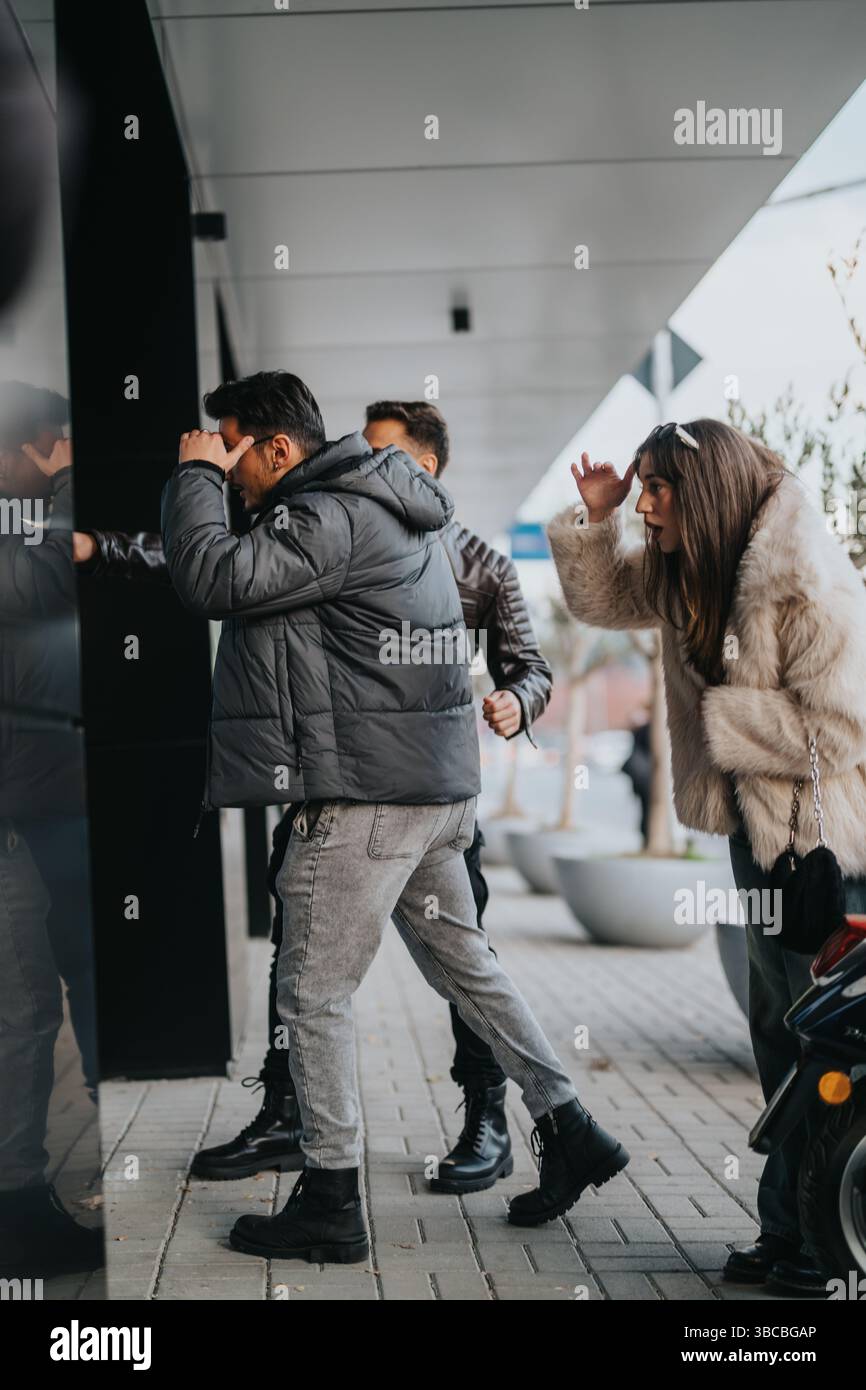Group of friends looking through a window on a city sidewalk Stock ...