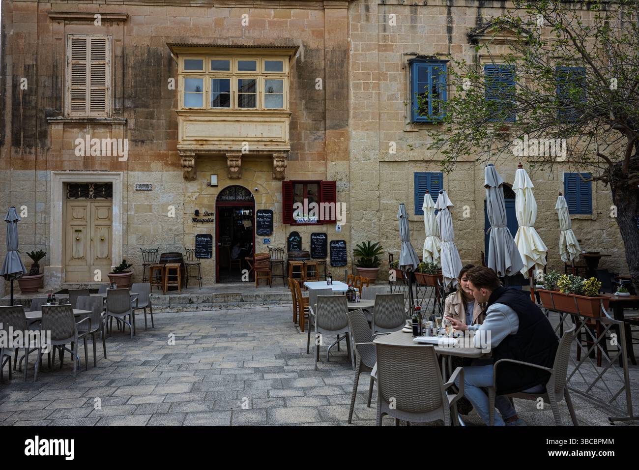 Valetta, Malta — April 7, 2025. A young couple have lunch at Don ...