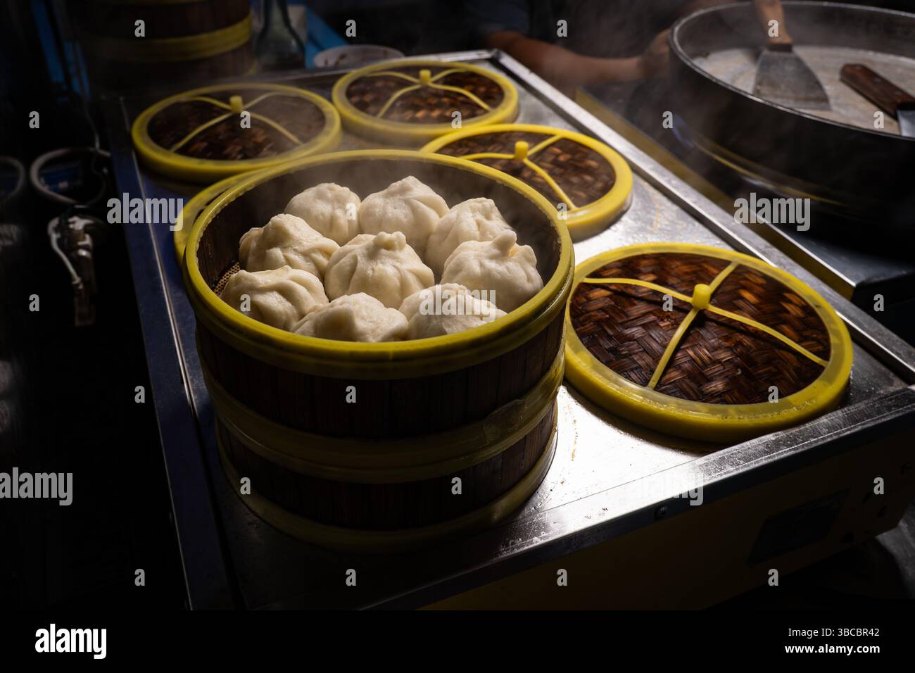 Bamboo steamer with baozi. Chinese stuffed steamed buns. Inside ...