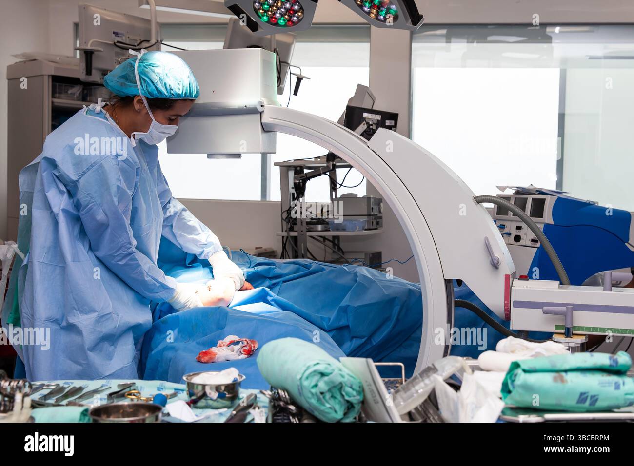 Female doctor performing a surgery. Orthopedic surgeon. Surgery and ...