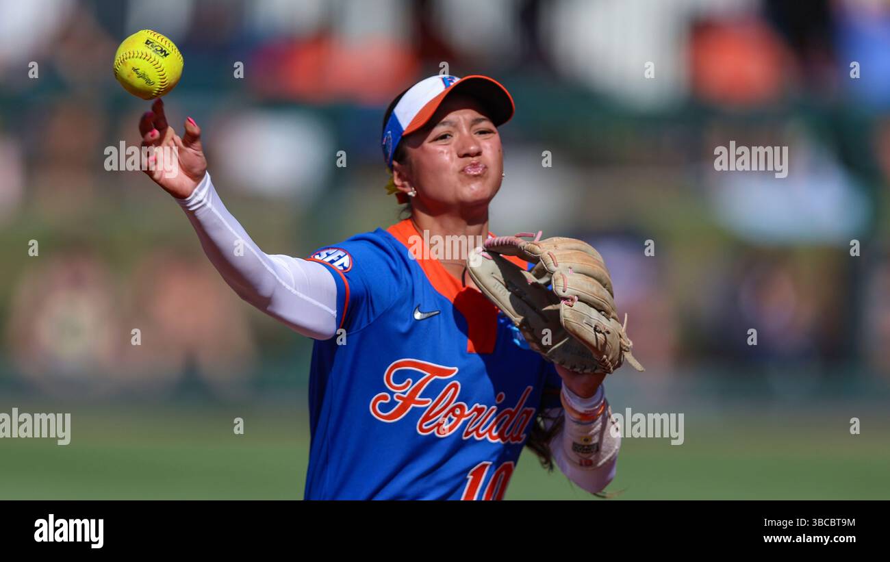 Florida infielder Gabi Comia (10) warms up before an NCAA regional ...