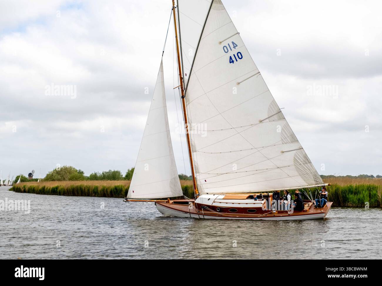 Upton, Norfolk, UK – May 18 2025. River cruiser tacking along the River ...
