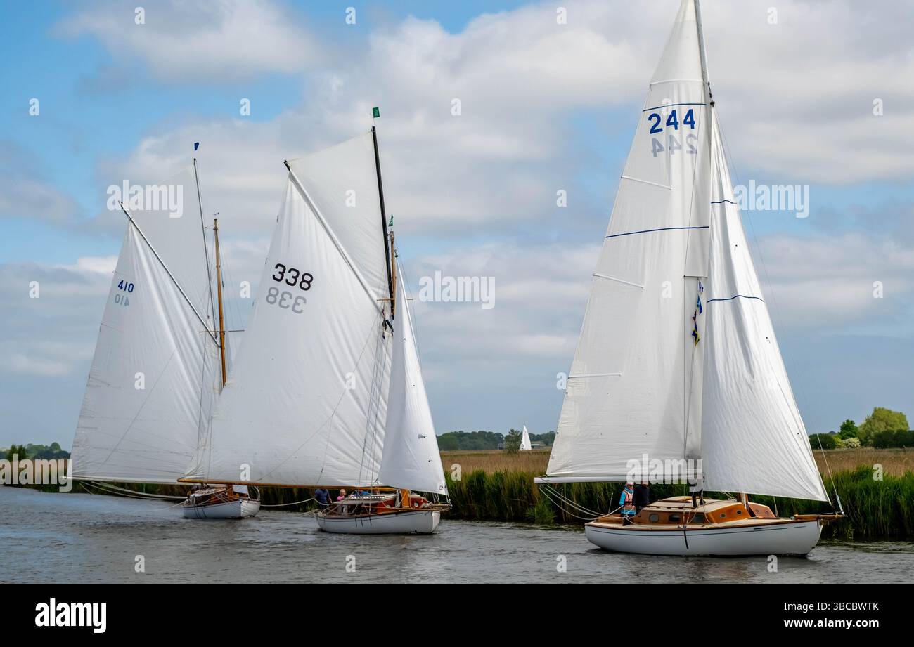 Upton, Norfolk, UK – May 18 2025. Procession of river cruiser sailing ...