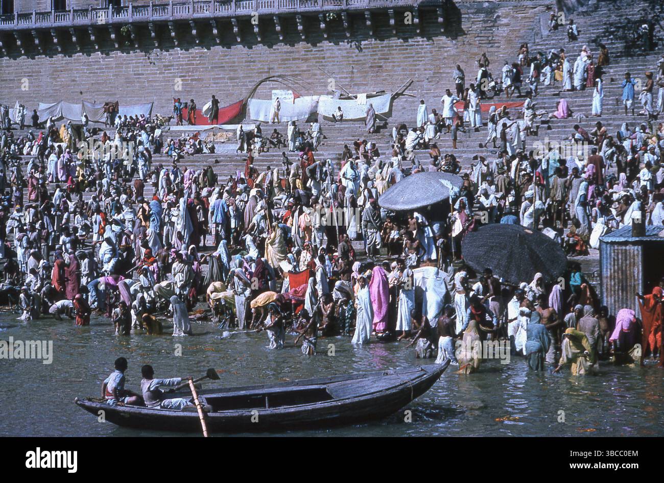 1960s, historical, hindus gathered together on the embankment of the ...