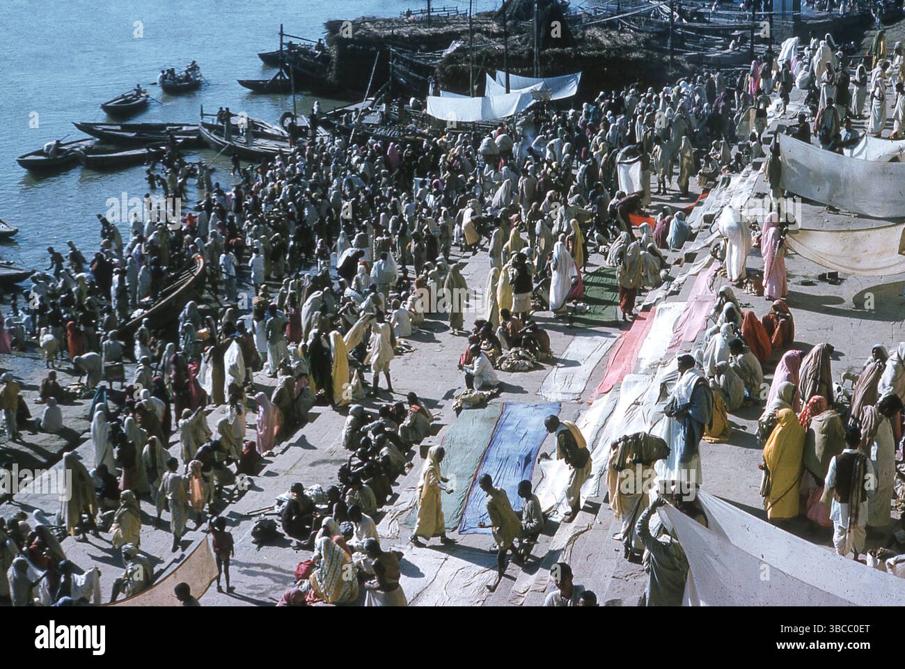 1960s, historical, hindus gathered together on the embankment of the ...