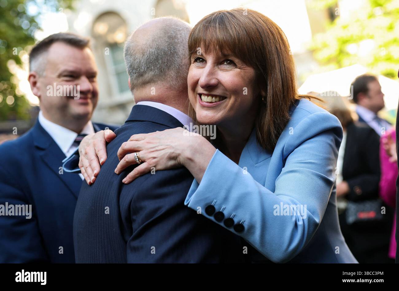 Chancellor of the Exchequer Rachel Reeves hugs a person after her ...