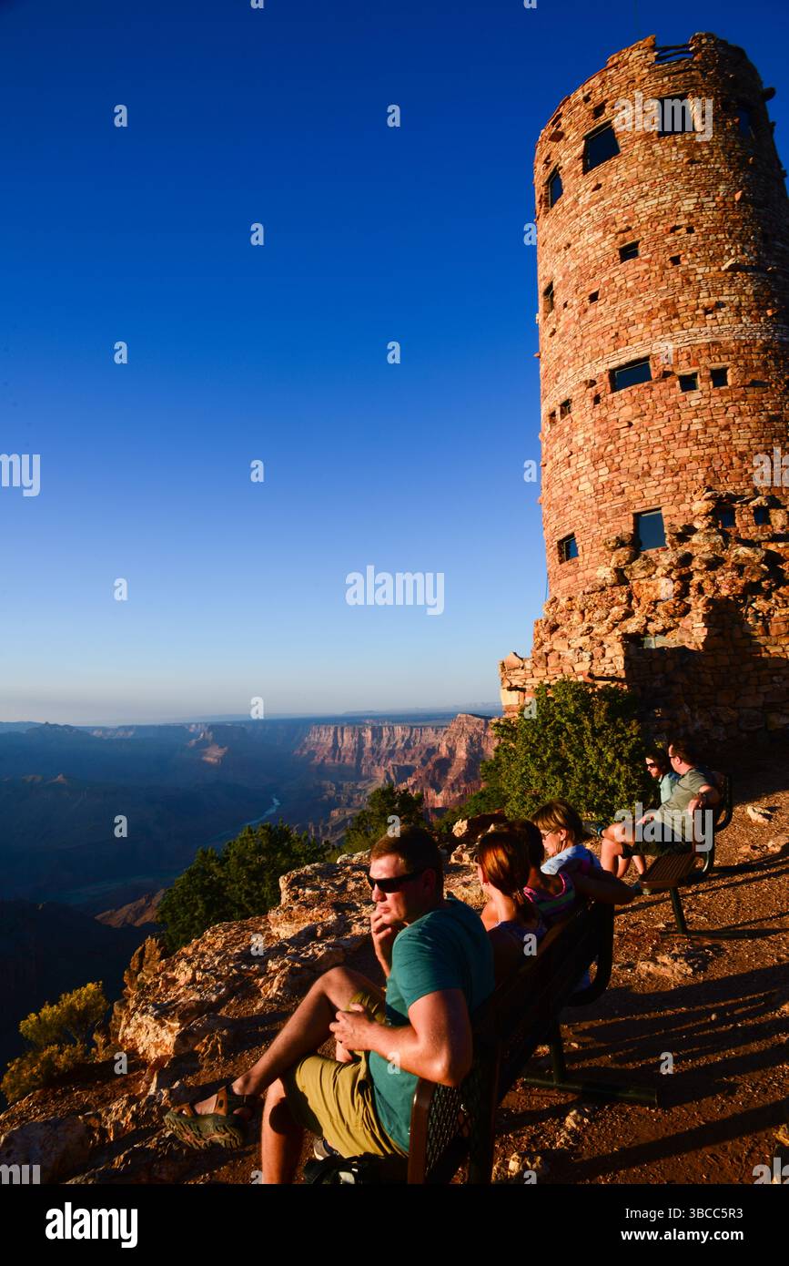 Visitors enjoying the views at sunset from Desert view watchtower in ...