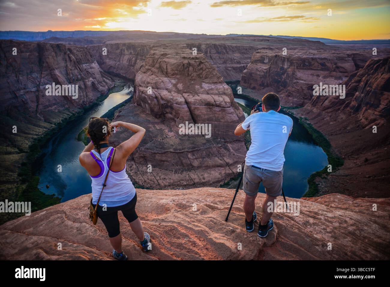 Photographers at Horseshoe bend, a horseshoe-shaped incised meander of ...