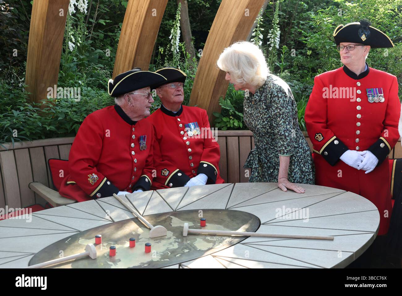 Britain's Queen Camilla speaks with Chelsea Pensioners members, at the ...