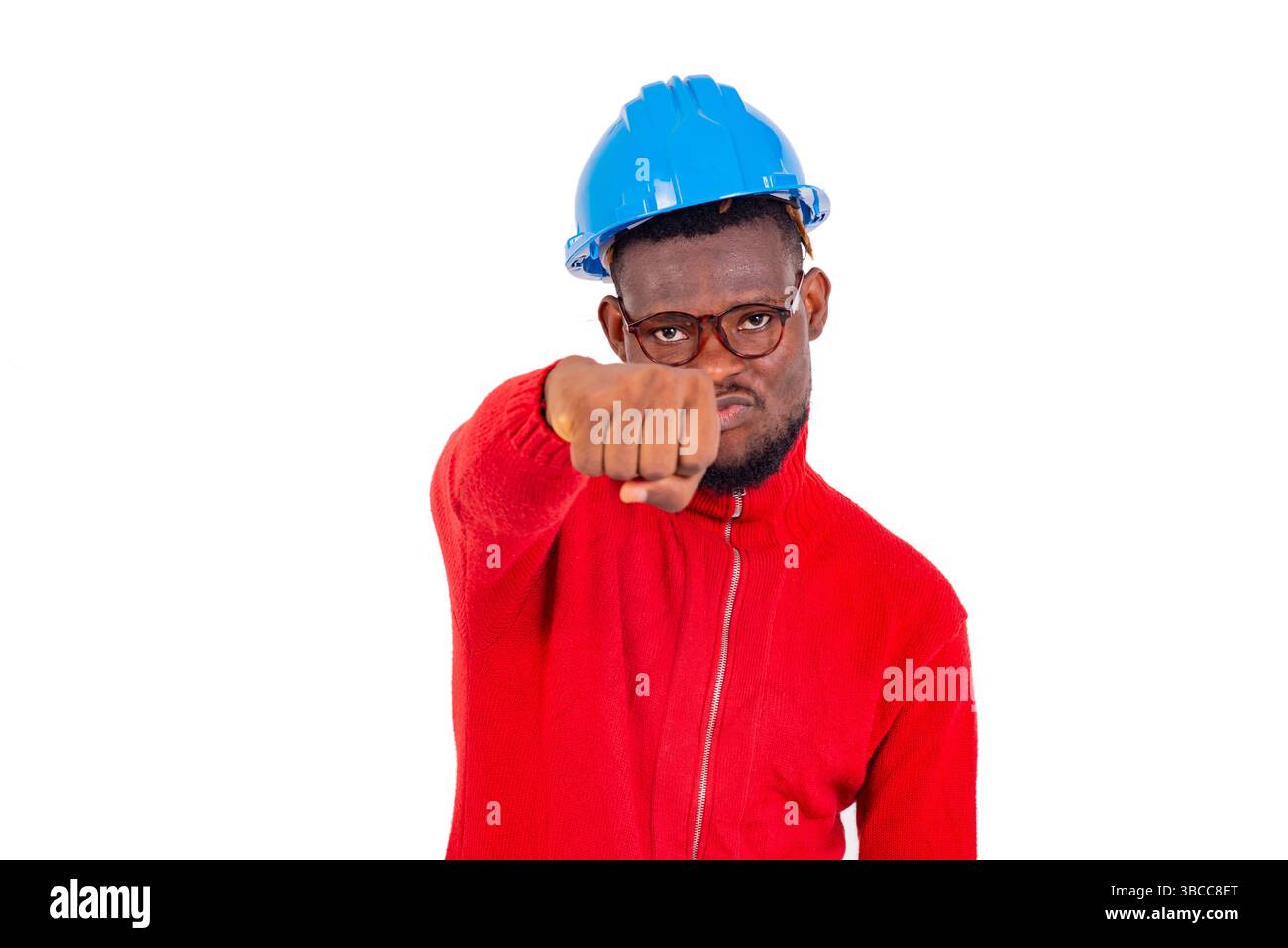 young man construction engineer wearing a blue safety helmet and ...