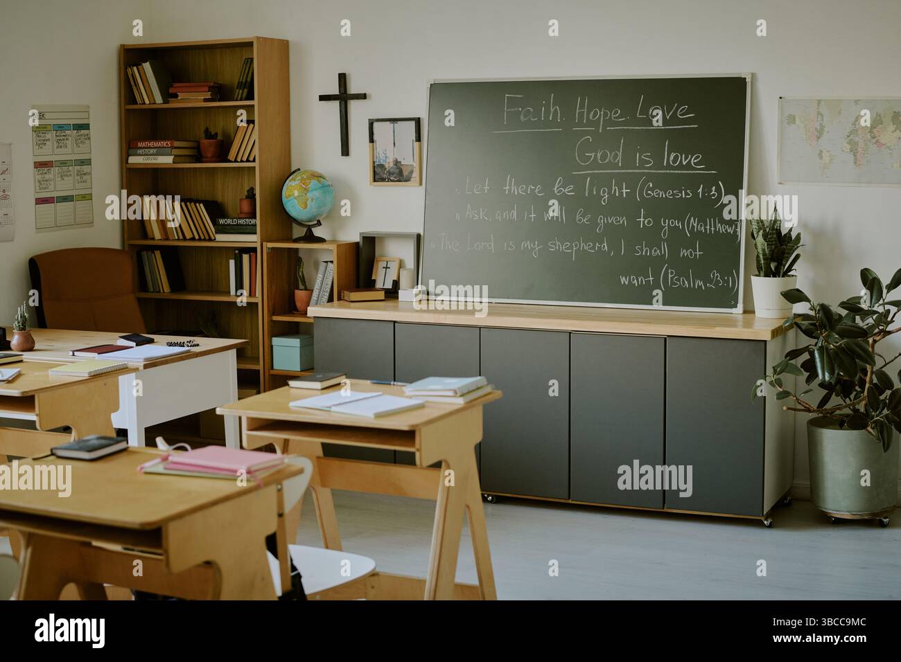 Empty classroom featuring desks, chairs, and chalkboard with ...
