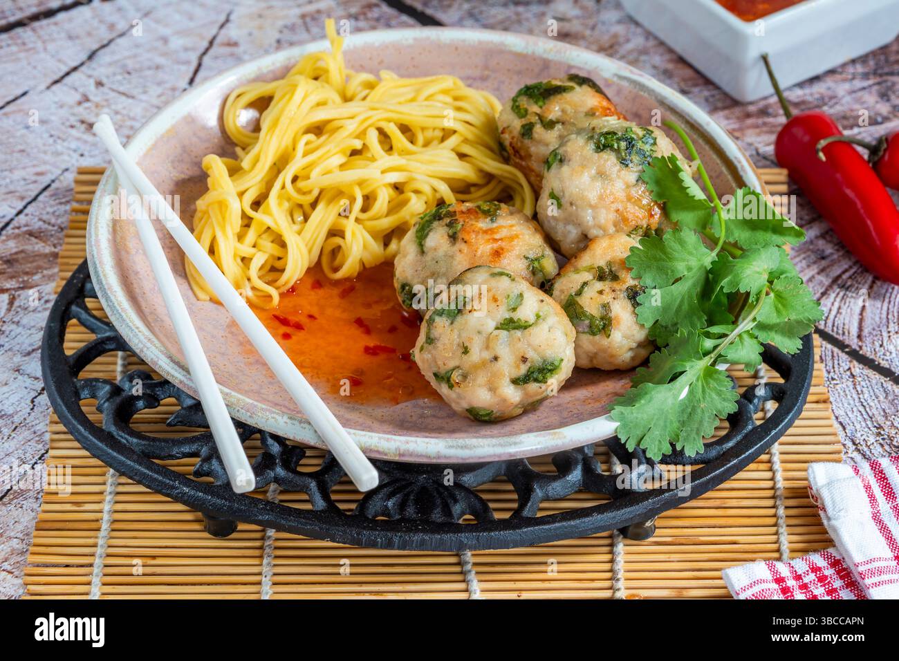 Thai-style turkey meatballs with sweet chilli sauce and egg noodles ...